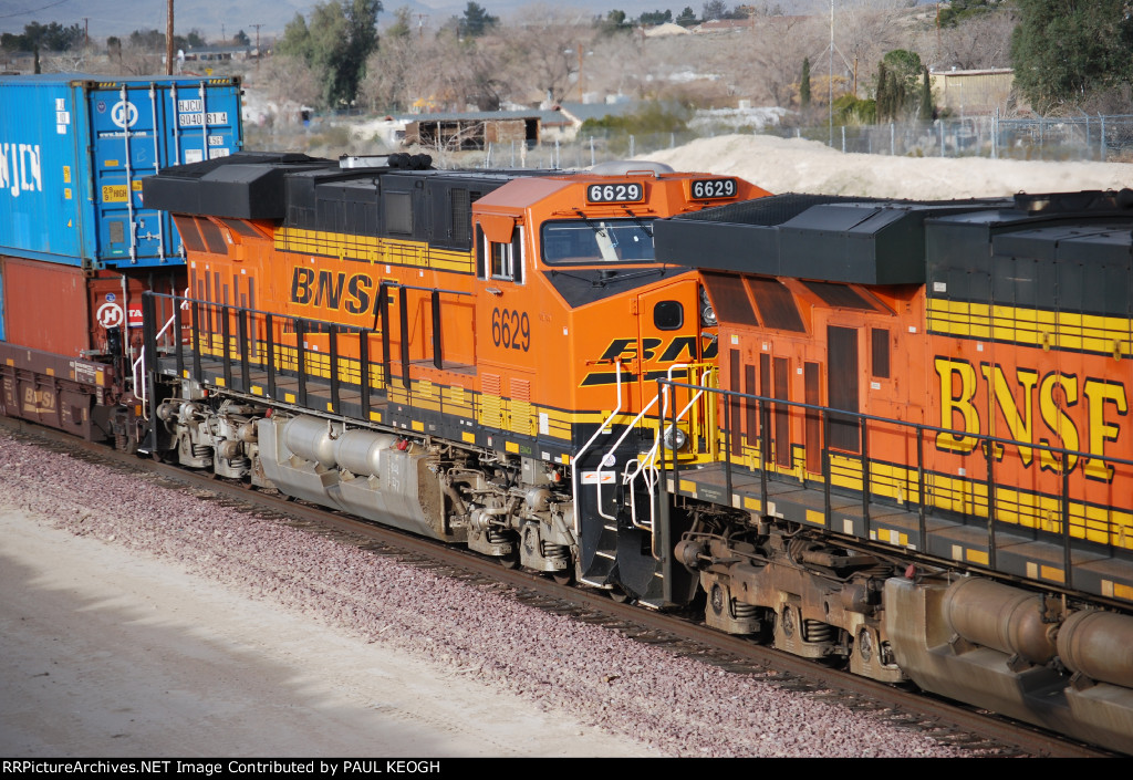 BNSF 6629 heads eastbound as the # 4 unit as they slow down for a crew swap.